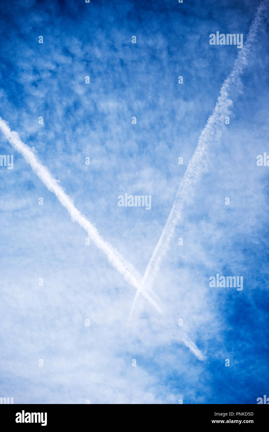 Jet contrails against unusual cloud formations in central Colorado, USA ...