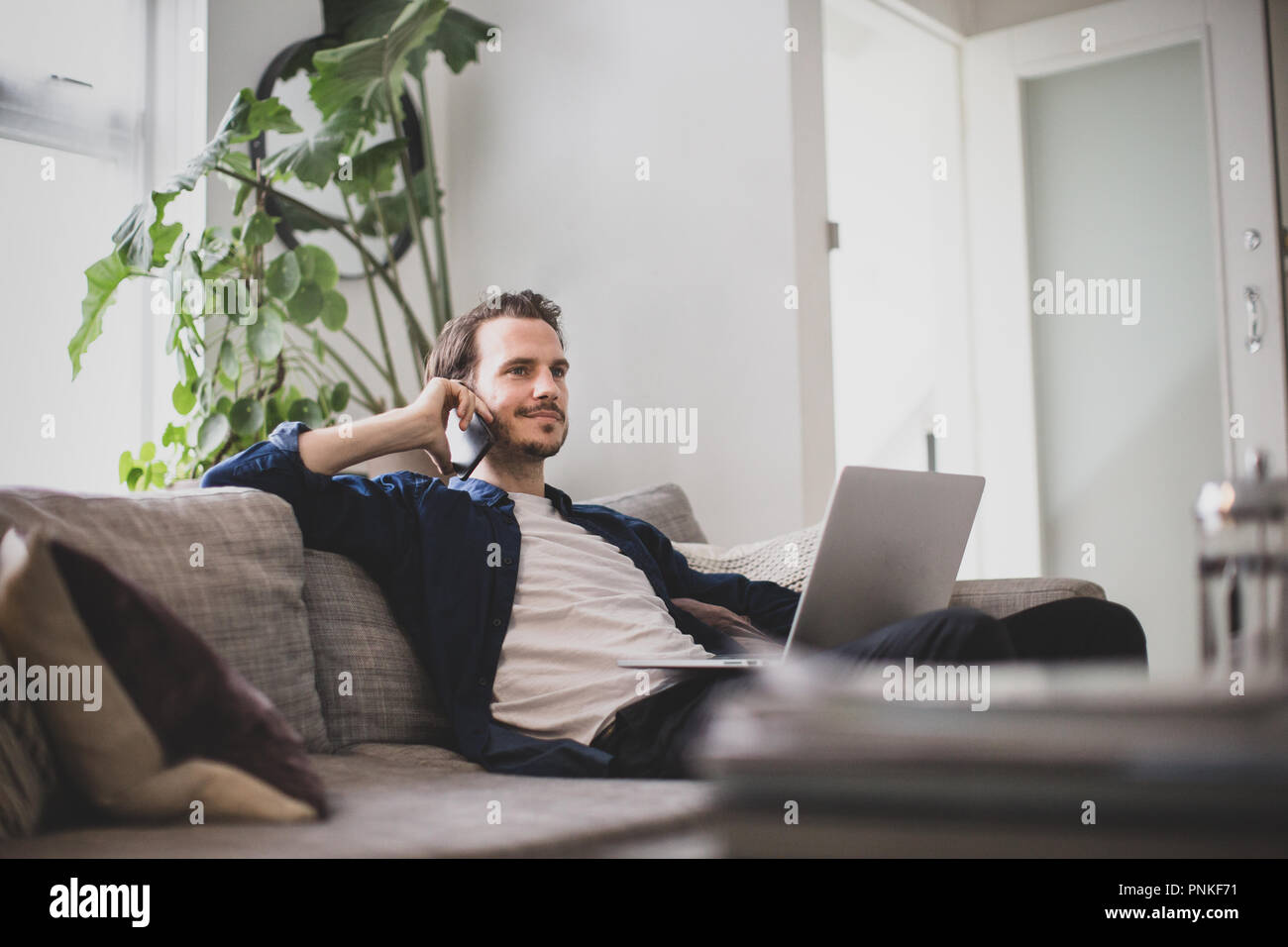 Working from sofa hi-res stock photography and images - Alamy
