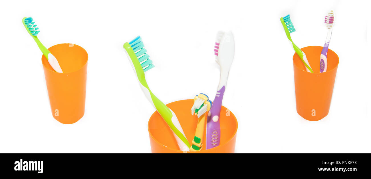 A toothbrush in a glass cup isolated on a white background. Care of ...