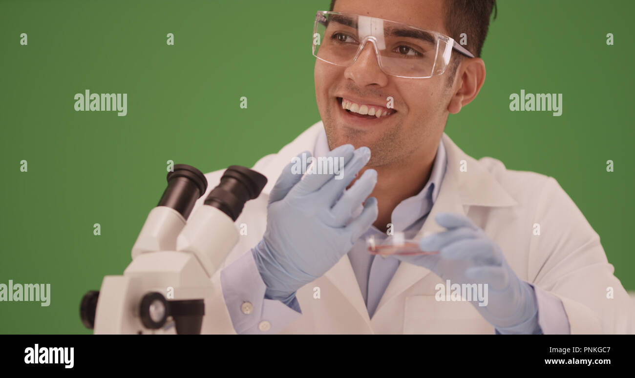 Latino scientist makes brilliant discovery in lab on green screen Stock ...