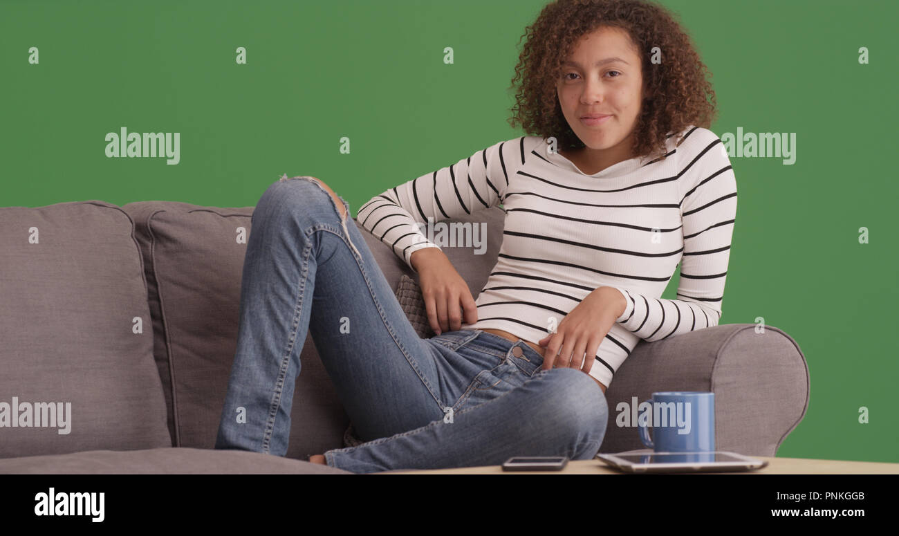 Woman lounging on couch hi-res stock photography and images - Alamy