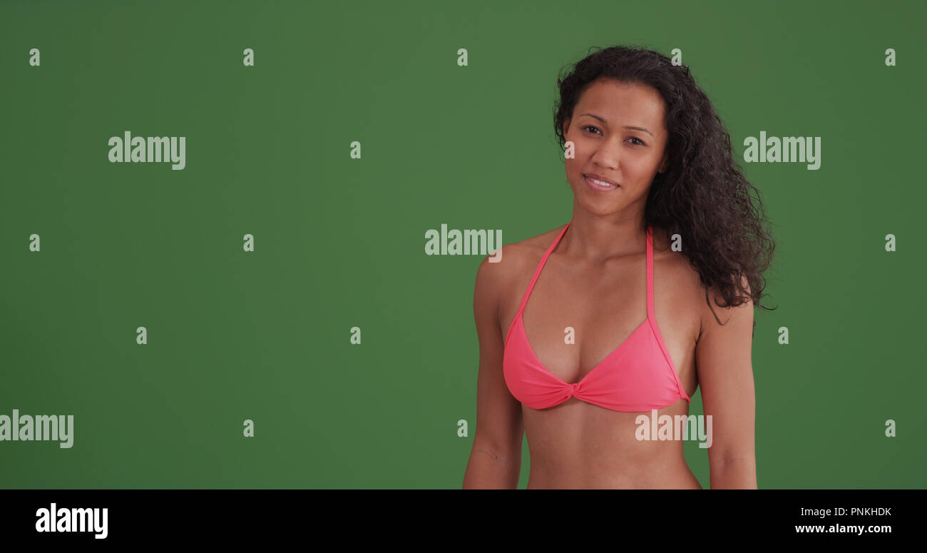 Young Filipino Woman In Bikini With Back To Camera On Green Screen
