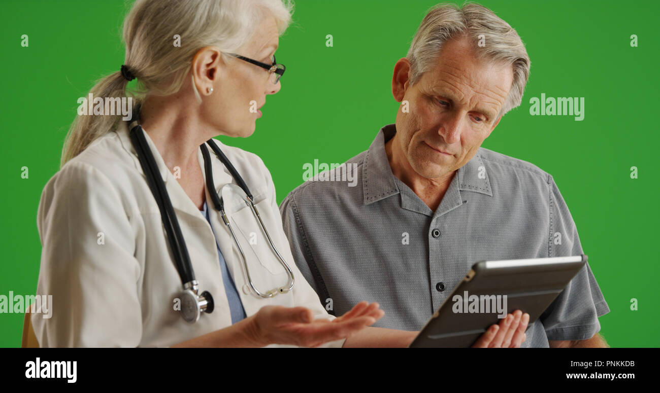 Healthcare professional using tablet green hi-res stock photography and ...