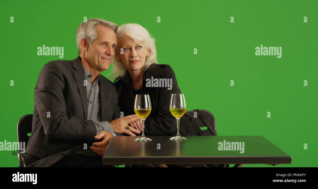 Elderly couple out on a date at restaurant together on green screen ...