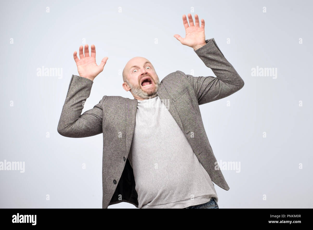 Closeup portrait of shocked stunned surprised mature man in casual suit ...