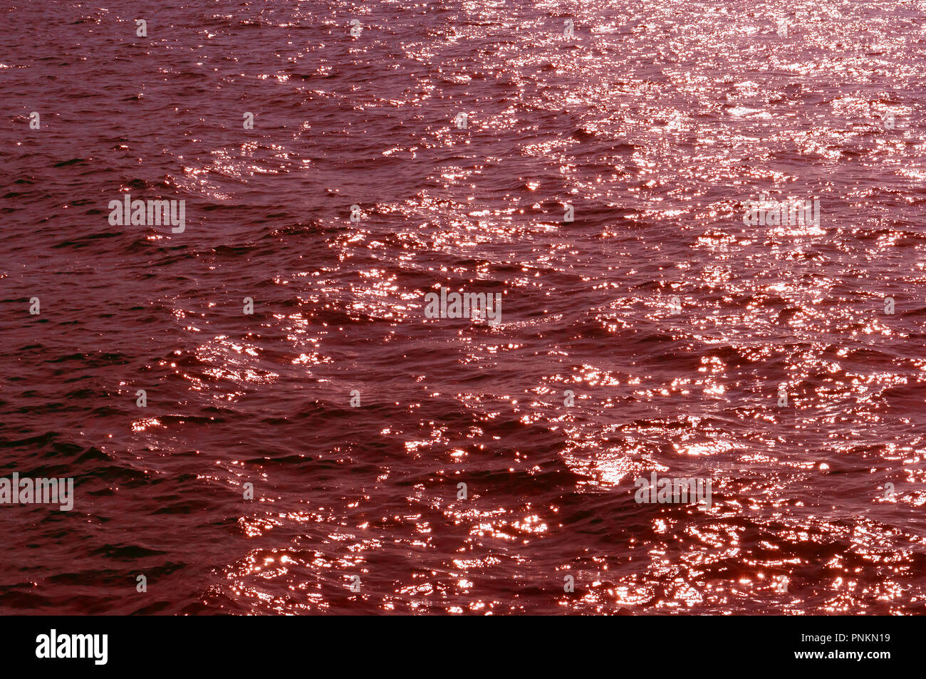 red tone, background water surface, ripple on the water Stock Photo - Alamy