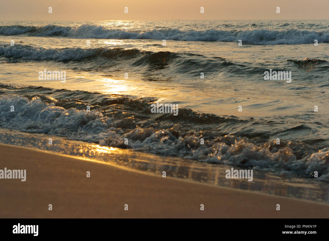 Sunset over the sea. Reflection of sunlight in the sea waves. Red sky ...