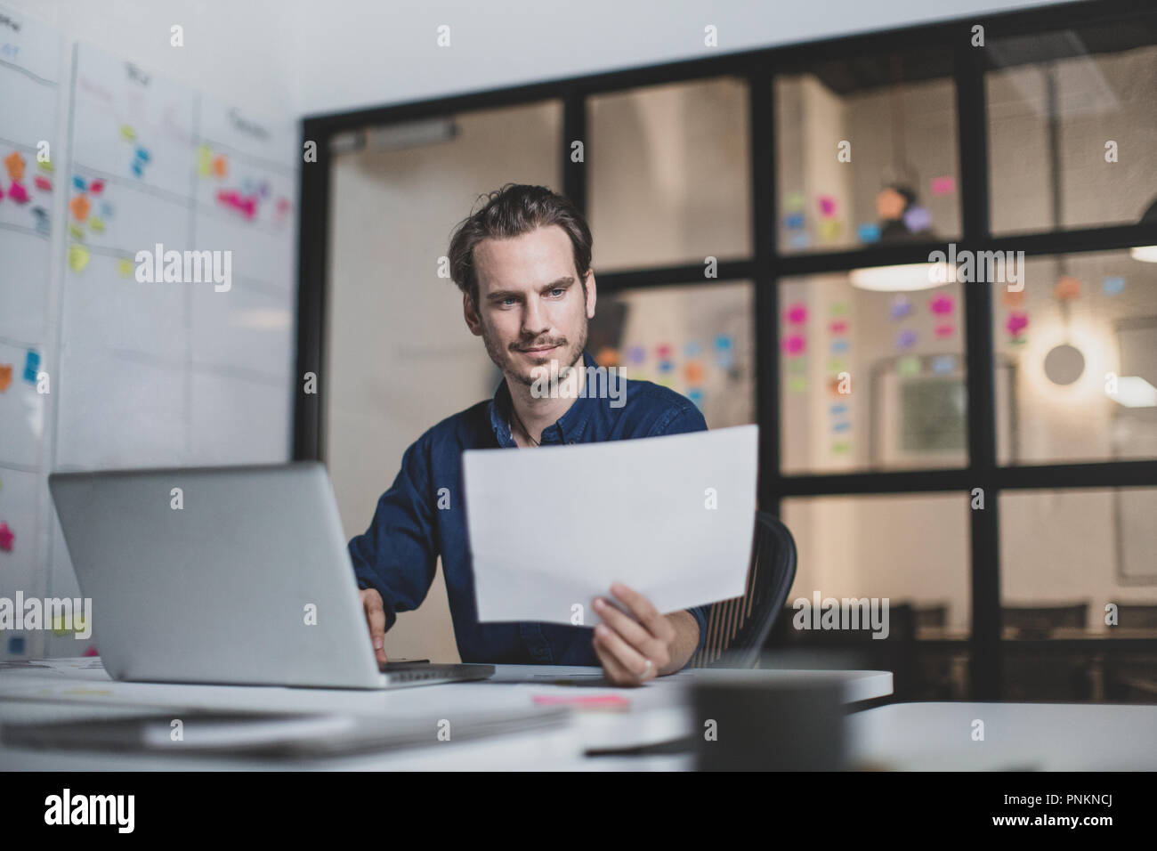 Male working late office desk hi-res stock photography and images - Alamy