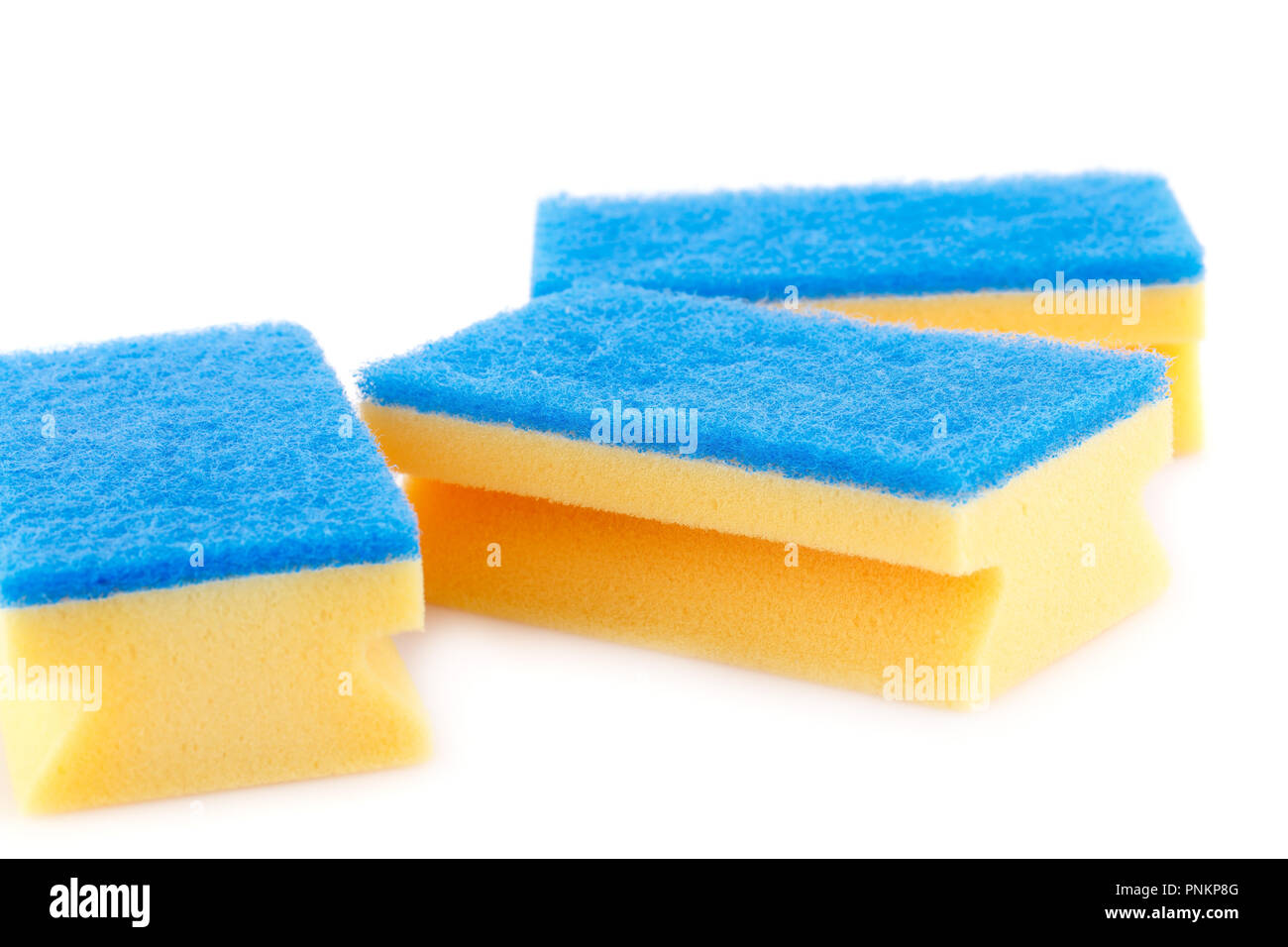 Pile of sponges isolated on white background Stock Photo - Alamy