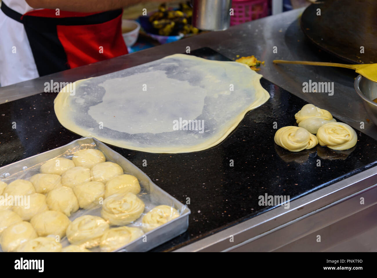 Make roti on the pan Stock Photo - Alamy