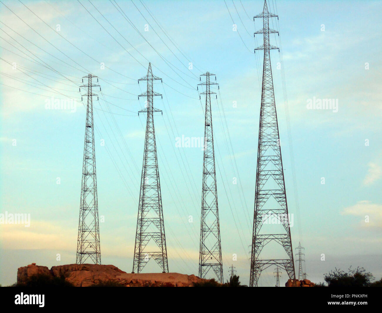 Some very tall, slim and elegant electrical power pylons, that carry ...