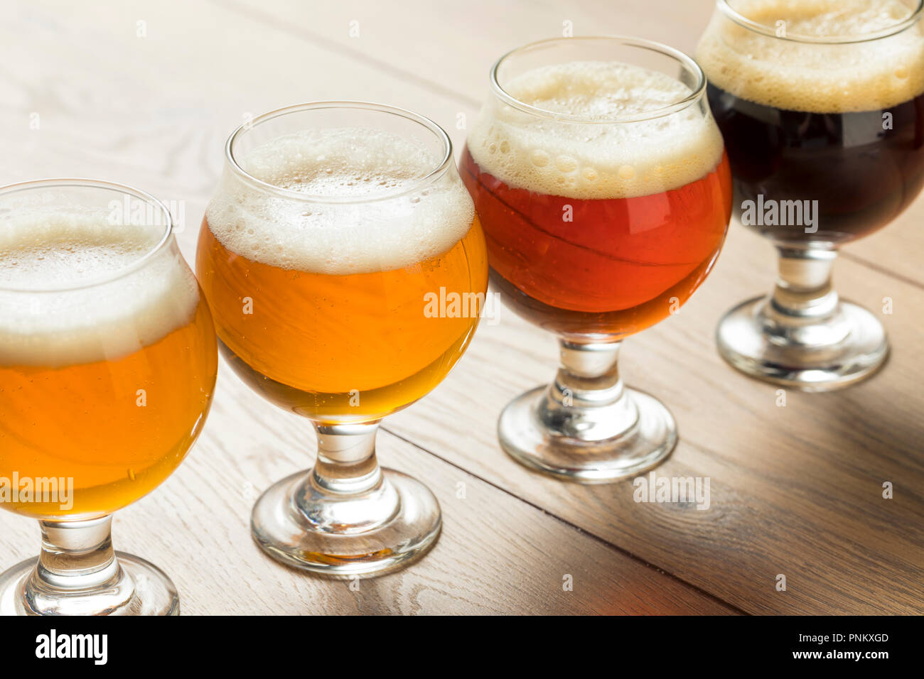 Refreshing Cold Beer Flight with Lager IPA and Porter Stock Photo - Alamy