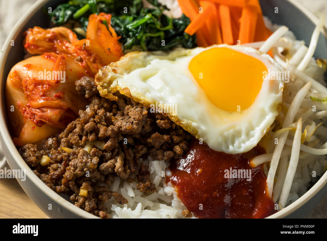 Spicy Homemade Korean Bibimbap Rice with Egg and Beef Stock Photo - Alamy
