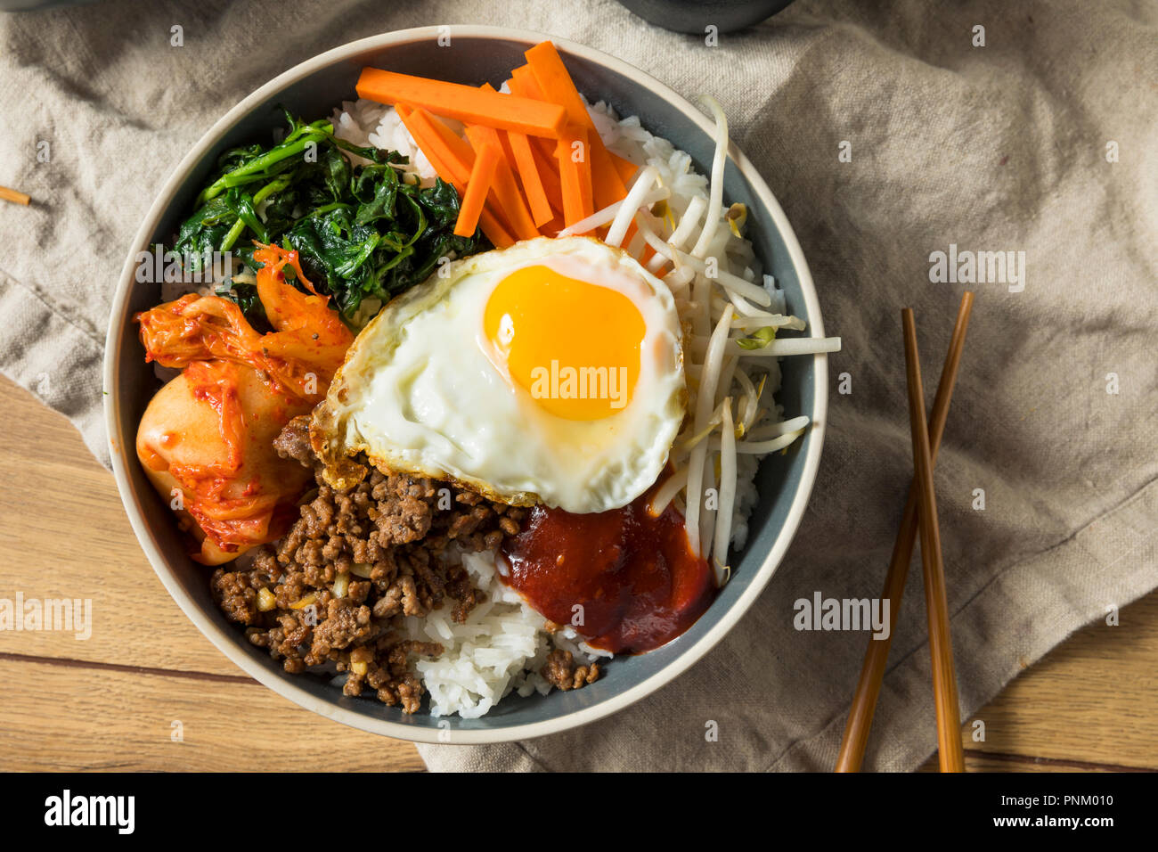 Spicy Homemade Korean Bibimbap Rice with Egg and Beef Stock Photo - Alamy