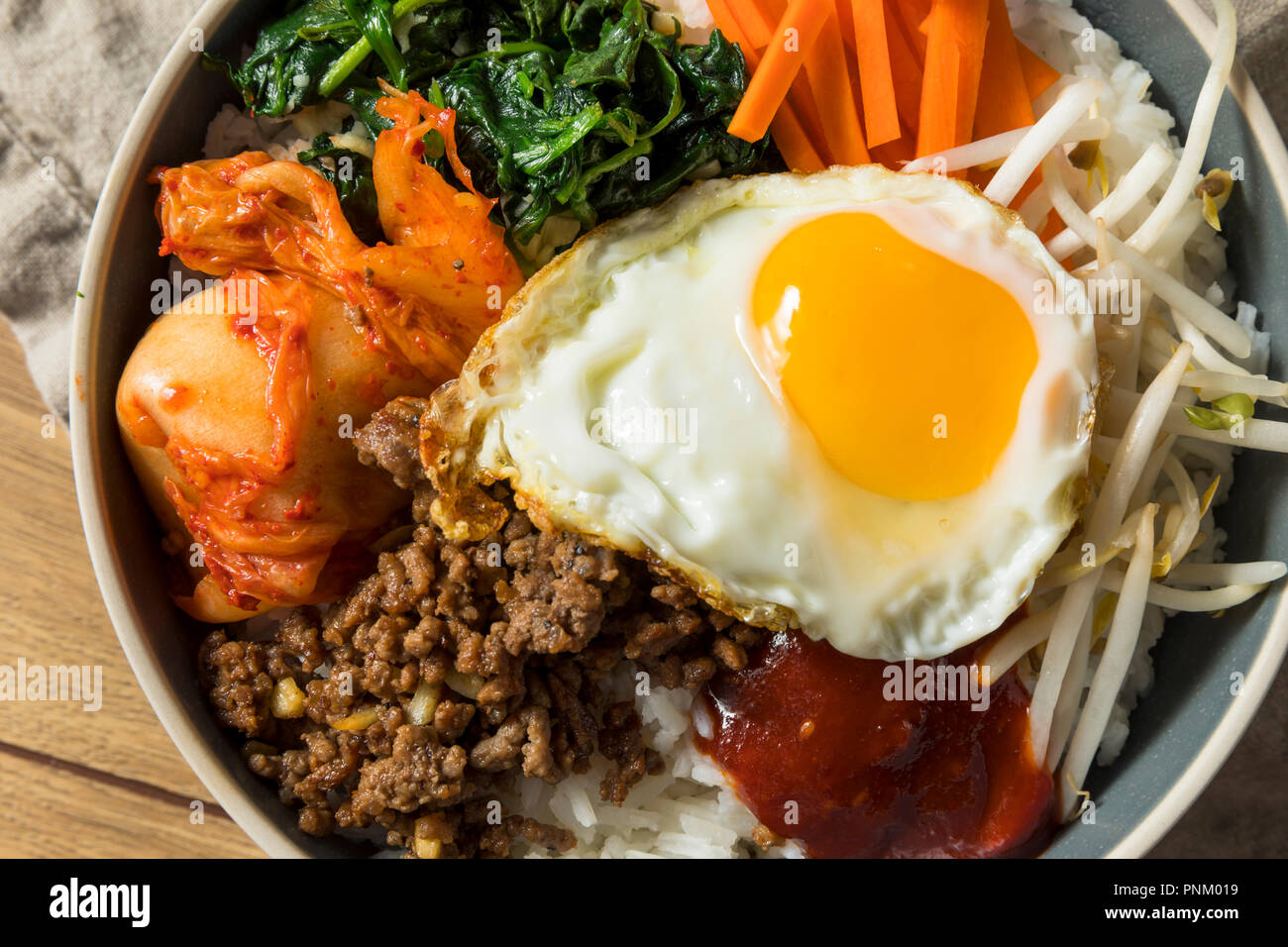 Spicy Homemade Korean Bibimbap Rice with Egg and Beef Stock Photo - Alamy