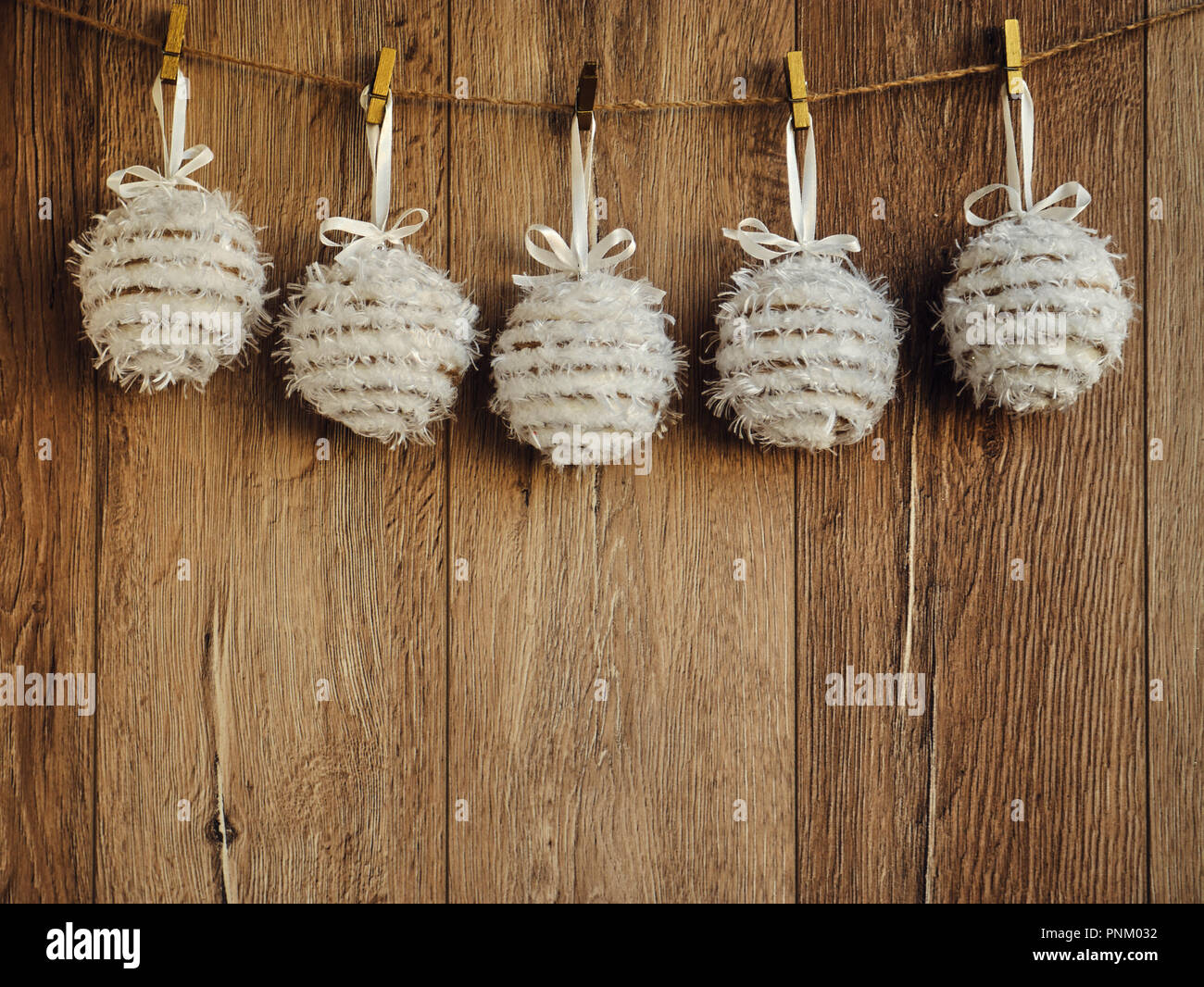 Christmas decorations white textile snowballs on the wooden background ...