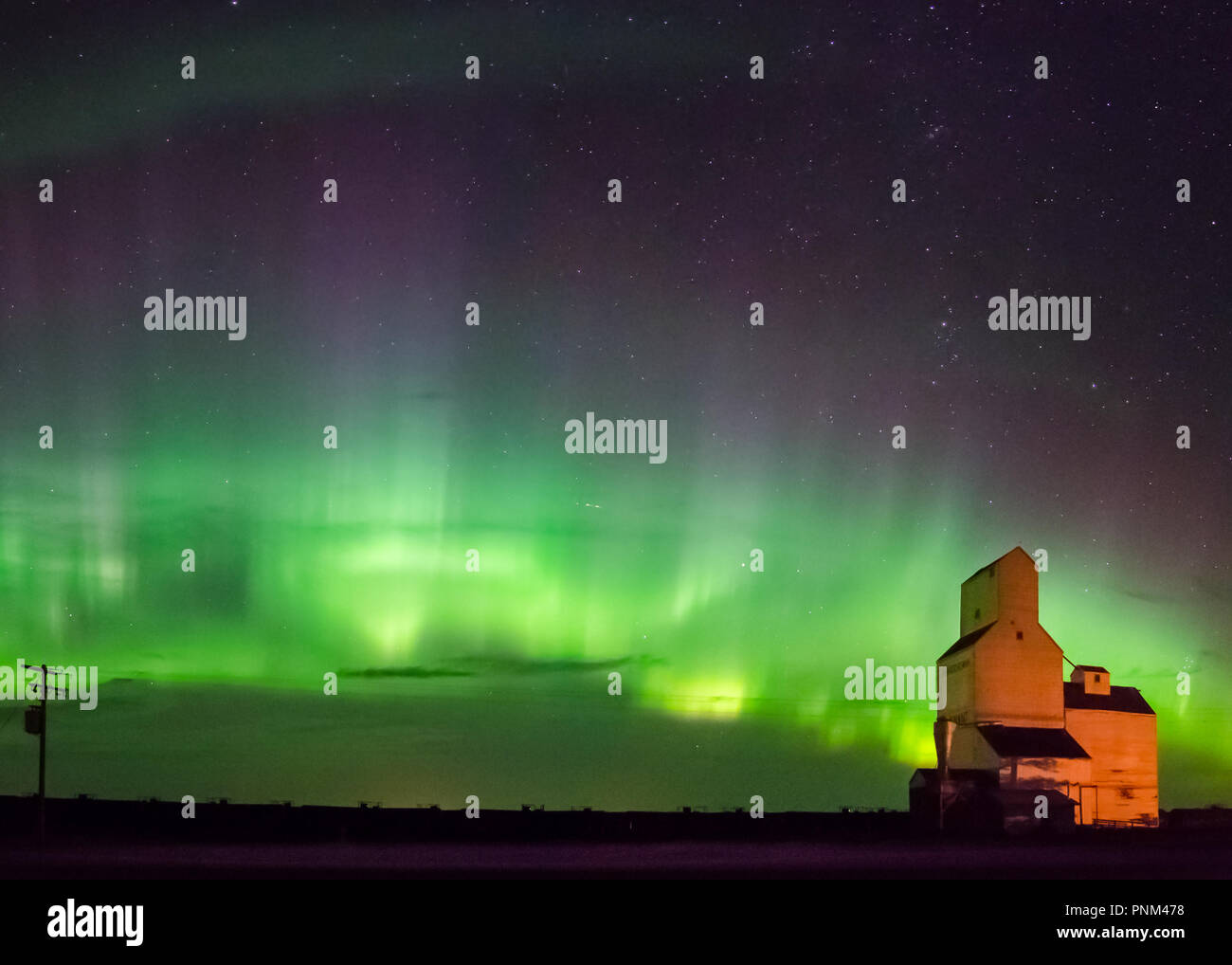 Aurora Borealis over a historic grain elevator in Pennant, Saskatchewan ...