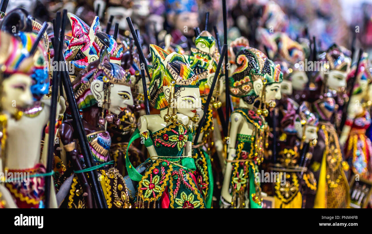 Wooden puppet with traditional batik fabrique called `wayang golek ...