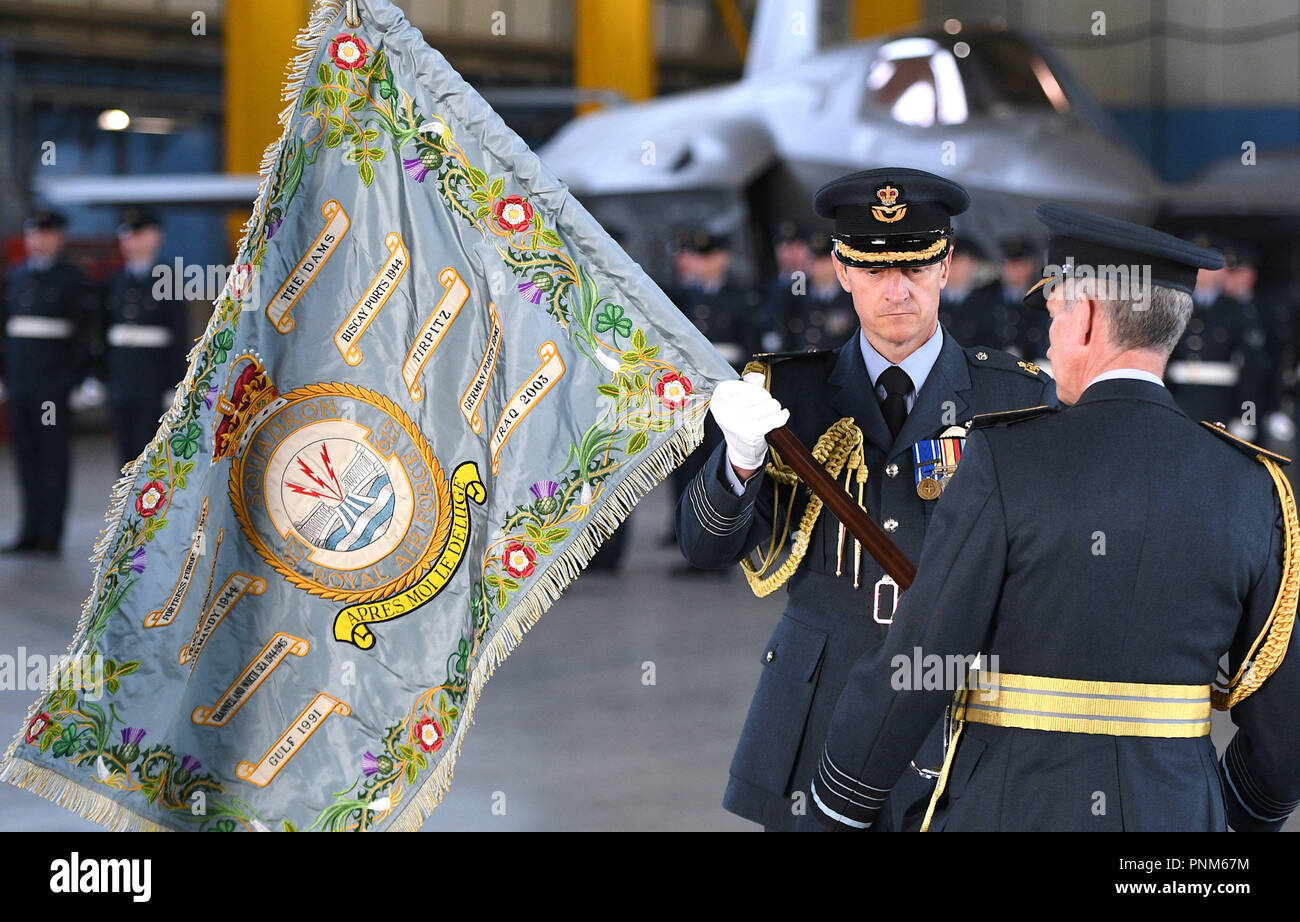 RAF Marham station commander Ian Townsend (left) presents 617 Squadron ...