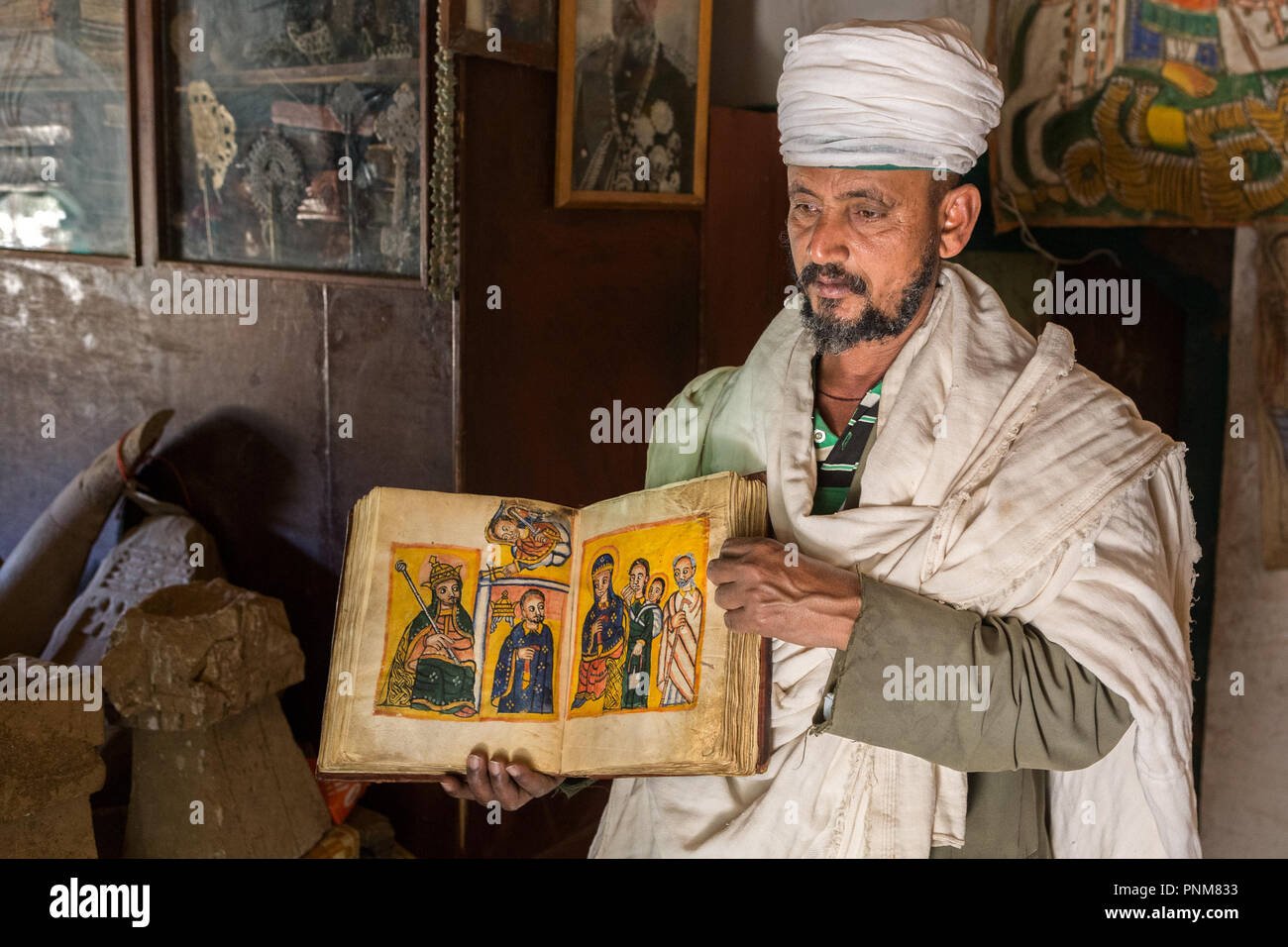 Monk and 300 year old New testament bible showing Mary, Joseph, cousin ...