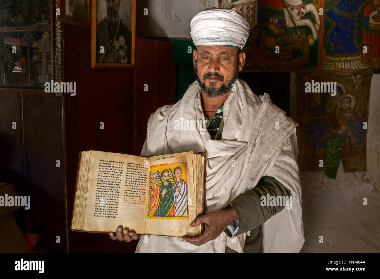 Monk and 300 year old New testament bible. Yeha Monastery, Ethiopia ...