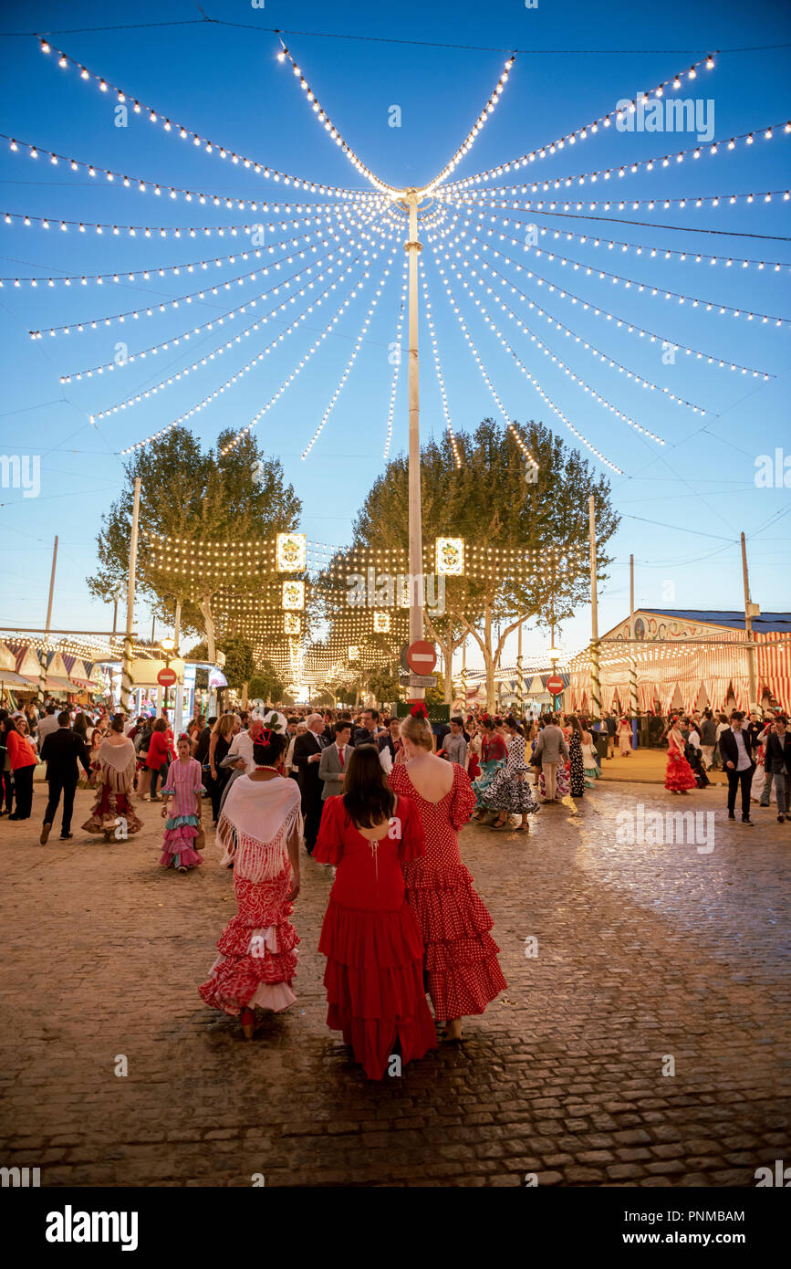 Spanish women with colorful flamenco dresses, evening mood, Feria de ...