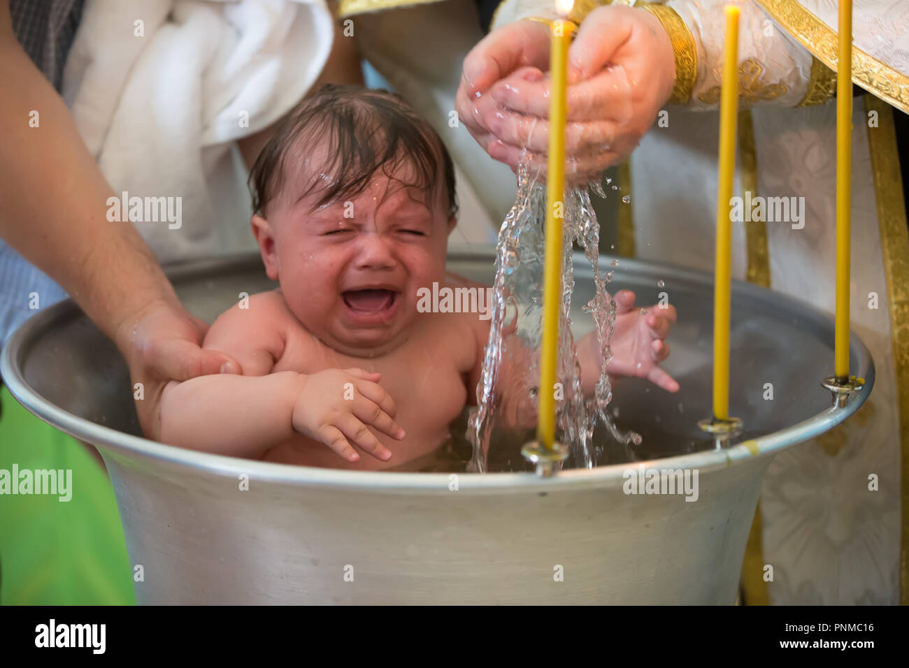 Christianity baptism pouring baby hi-res stock photography and images - Alamy