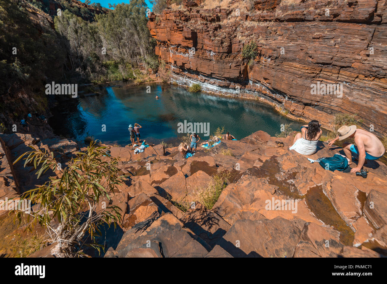 People relaxing on the rocks at, Fortescue falls, Dales Gorge, Karijini ...