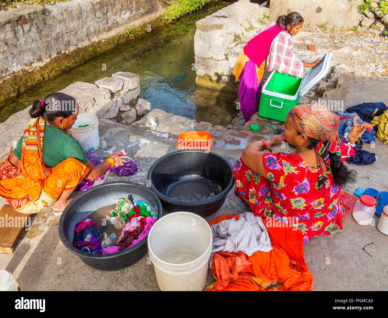 Indian woman washing clothes at Boar Canal, Kaladhungi, Uttarakhand ...