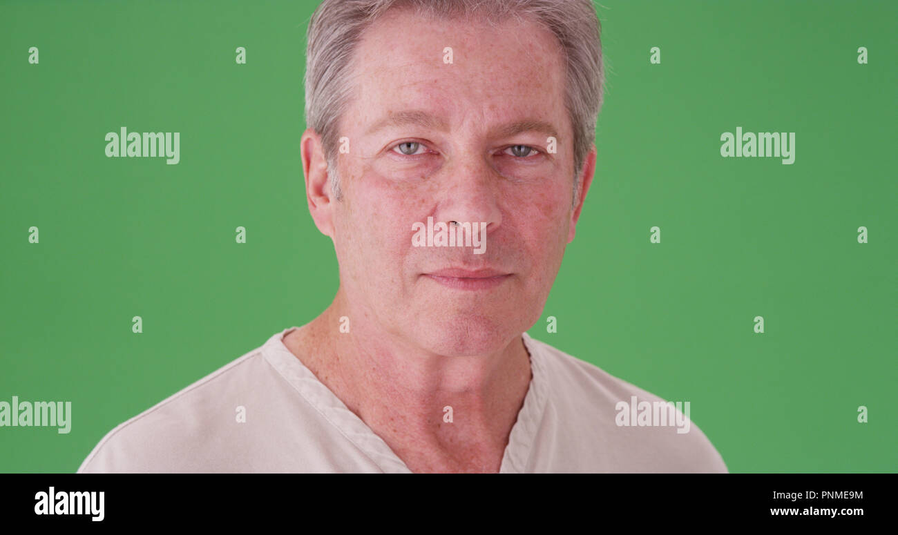 Portrait of a somber mature white male on greenscreen Stock Photo - Alamy