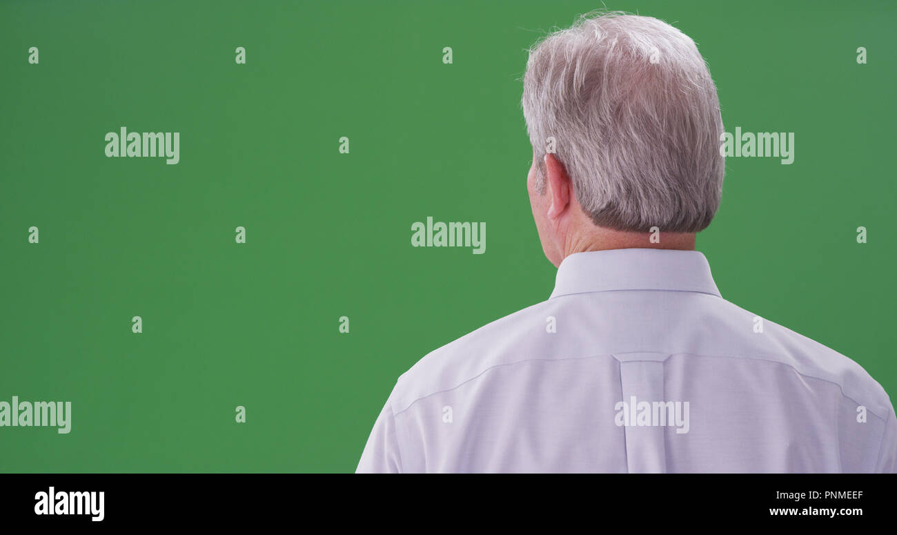 Portrait of old white man with back to camera on greenscreen Stock ...