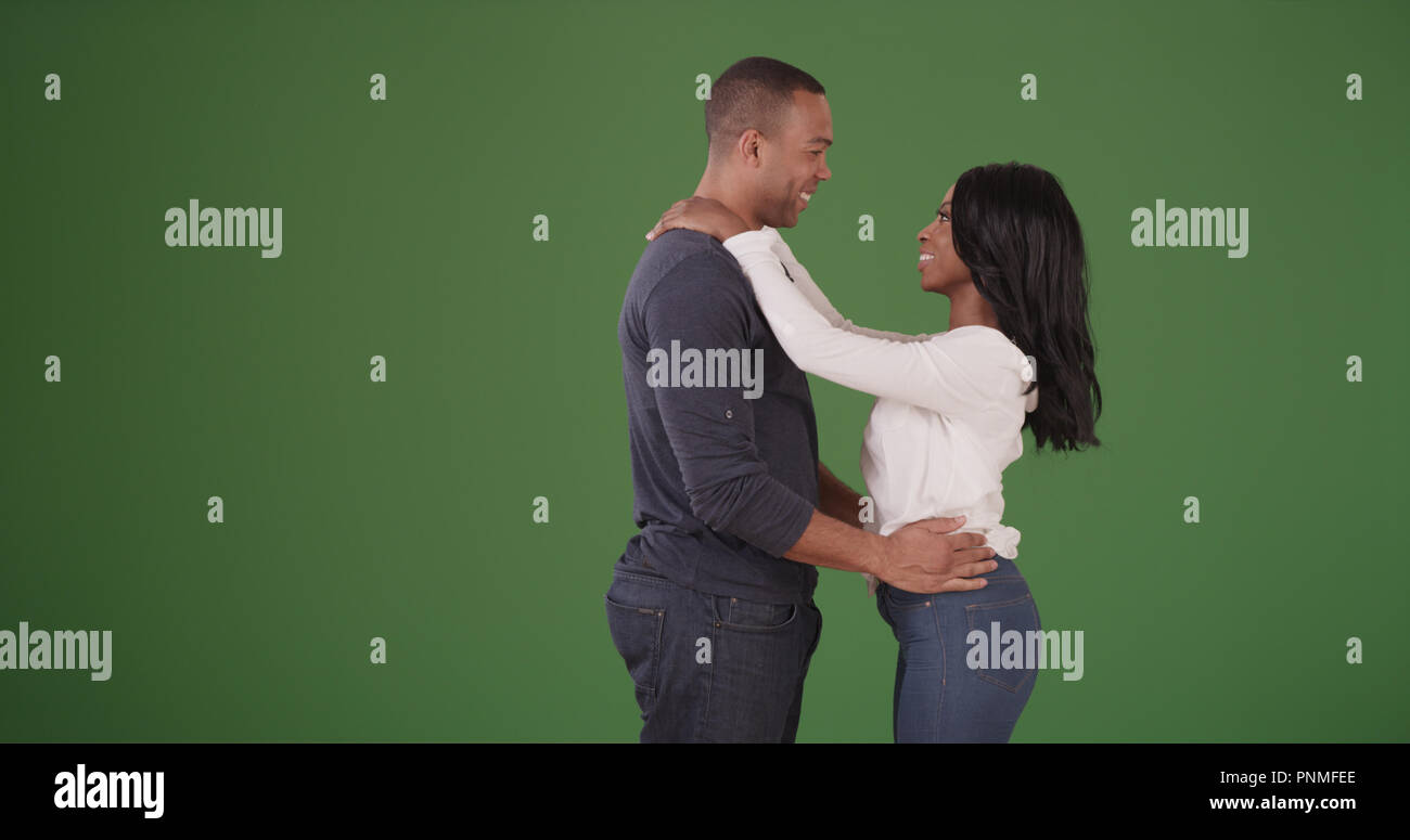 Young black couple sharing intimate moment on green screen Stock Photo ...