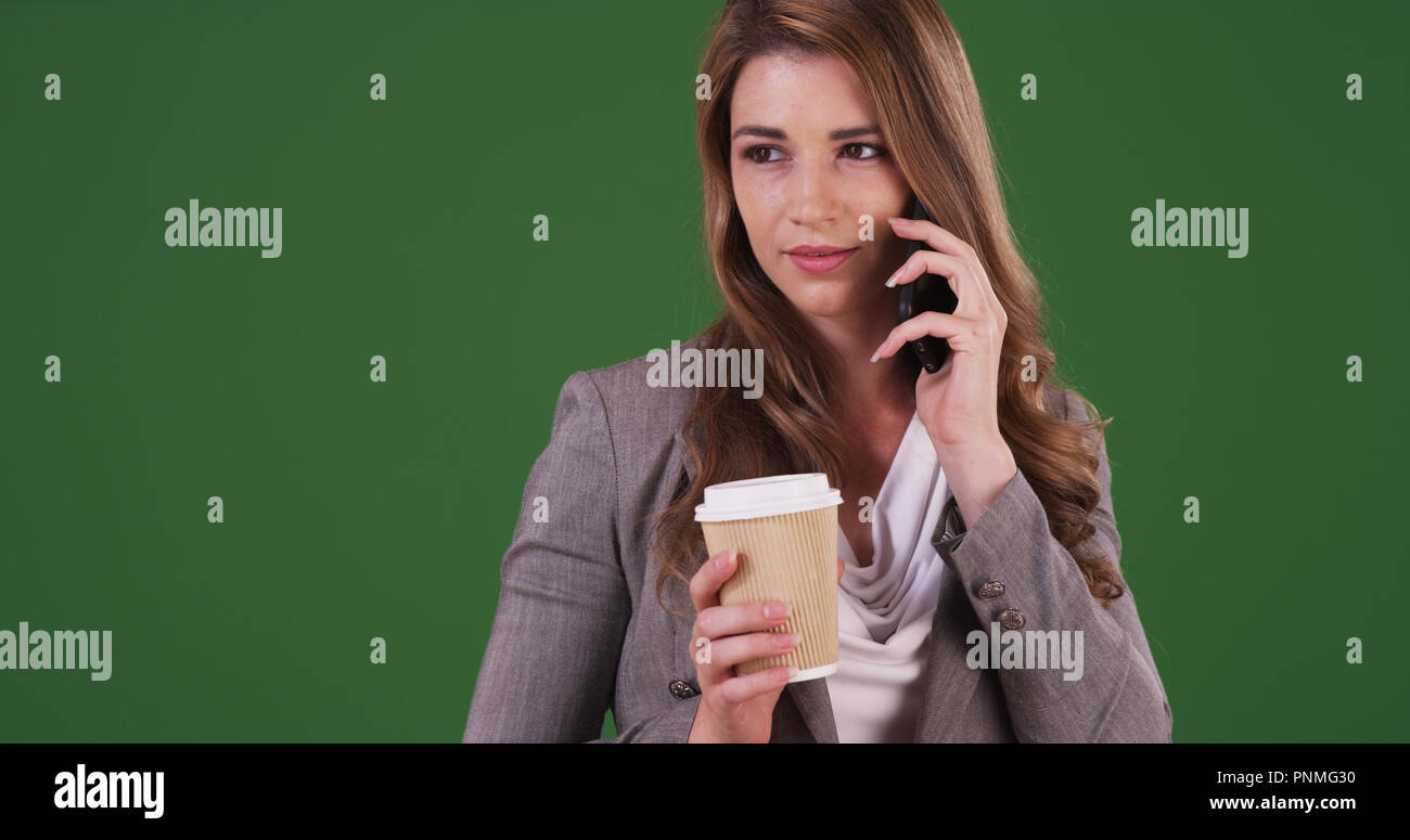 Female client holding smartphone greenscreen hi-res stock photography ...