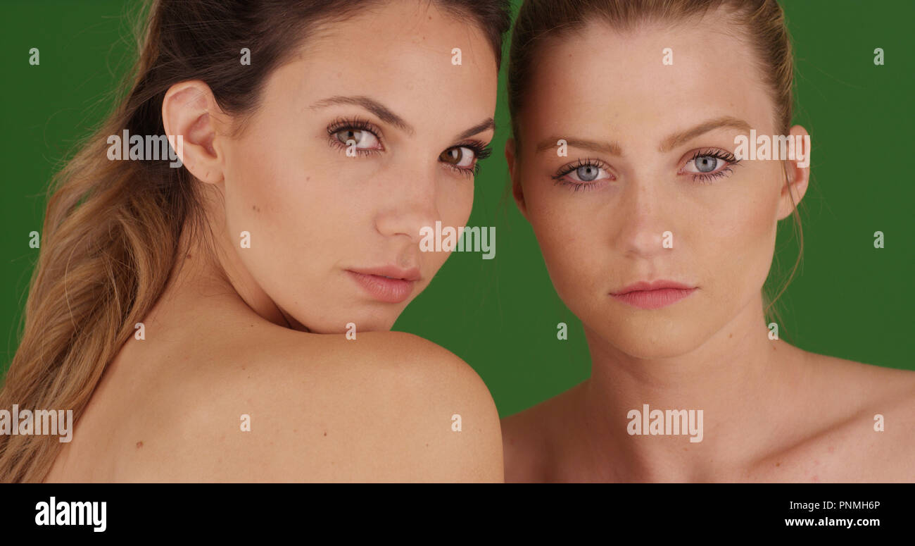 Attractive young female models posing in make-up on green screen Stock ...