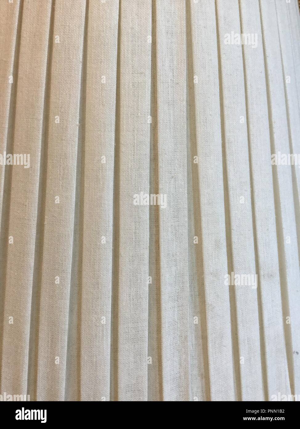 Off white window covering with folds Stock Photo - Alamy