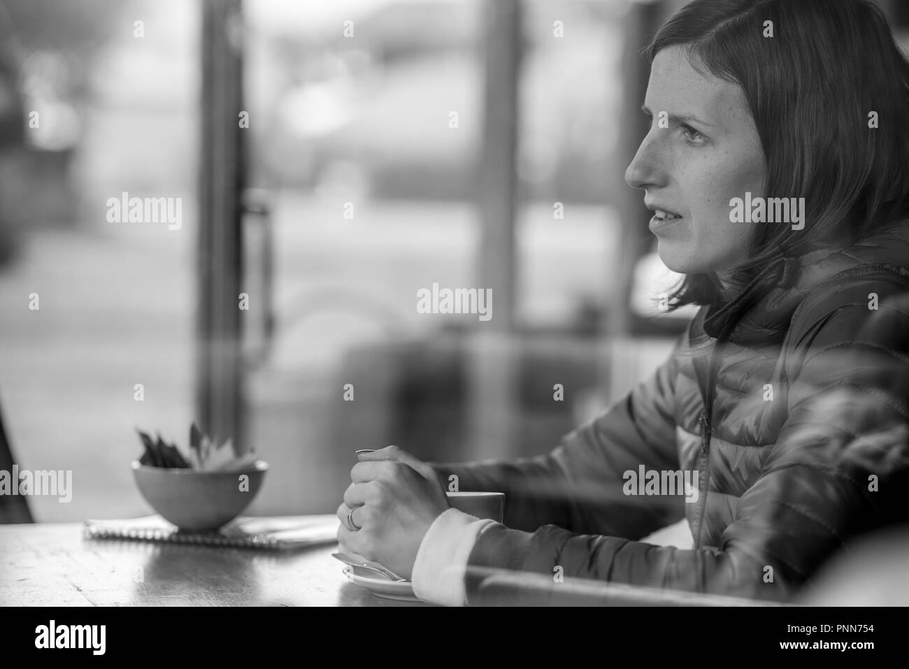 Image sad person sitting alone Black and White Stock Photos & Images ...