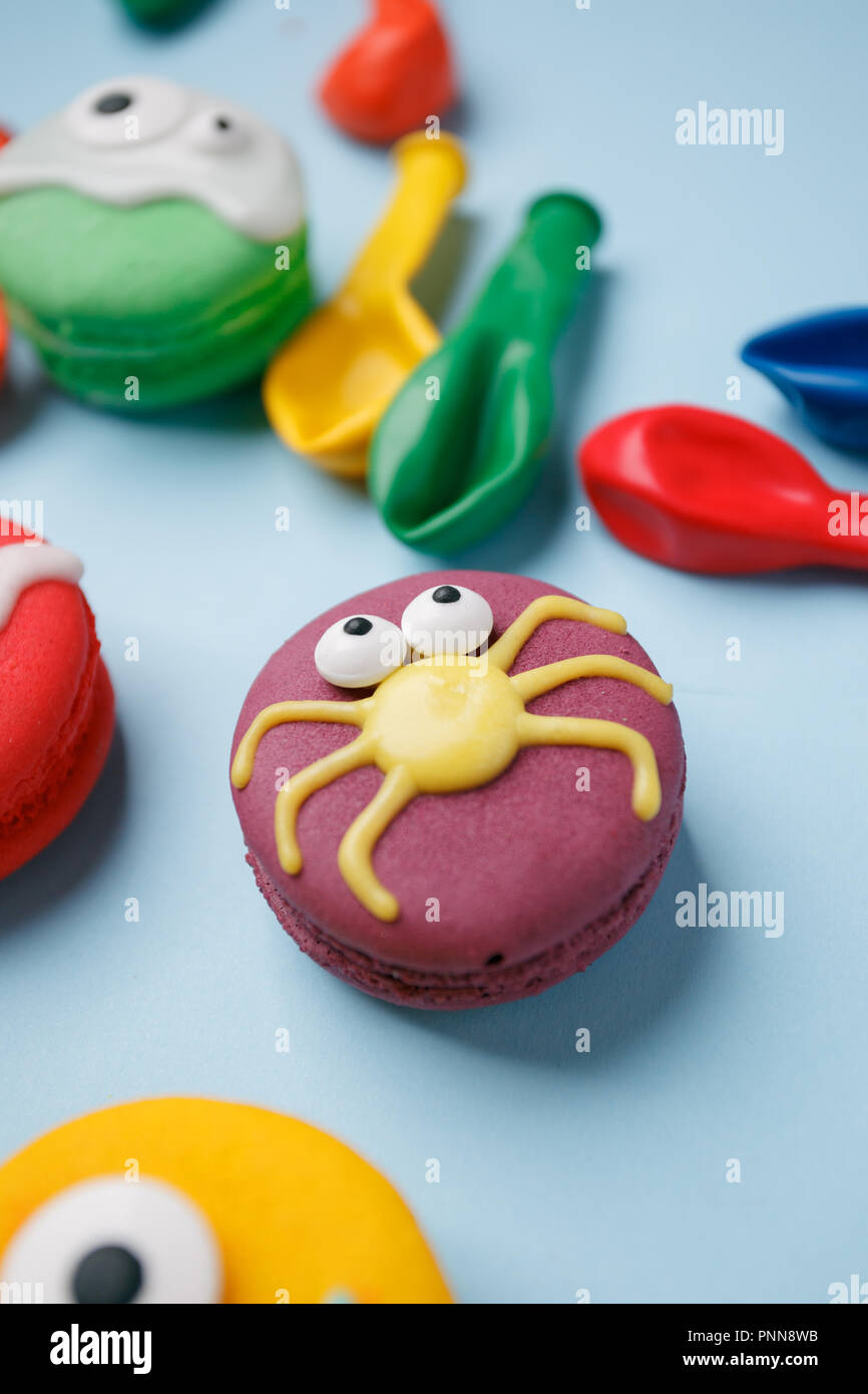 Delicious Halloween macaroons set with bright decorations made of ...
