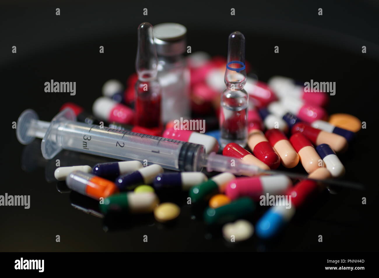 Pills and drugs. Medicine, capsules, tablets, injection, syringe and ...