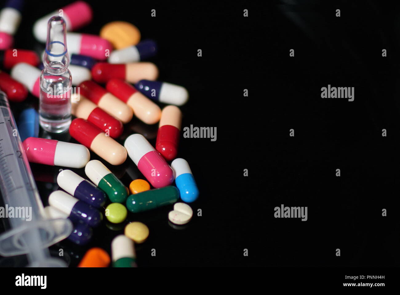 Medication capsules in an opened prescription bottle. Medicine ...