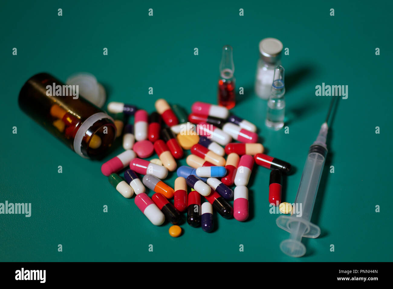 Medication capsules in an opened prescription bottle. Medicine ...