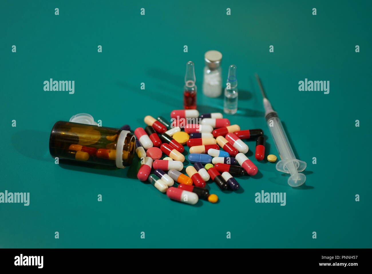 Medication capsules in an opened prescription bottle. Medicine ...