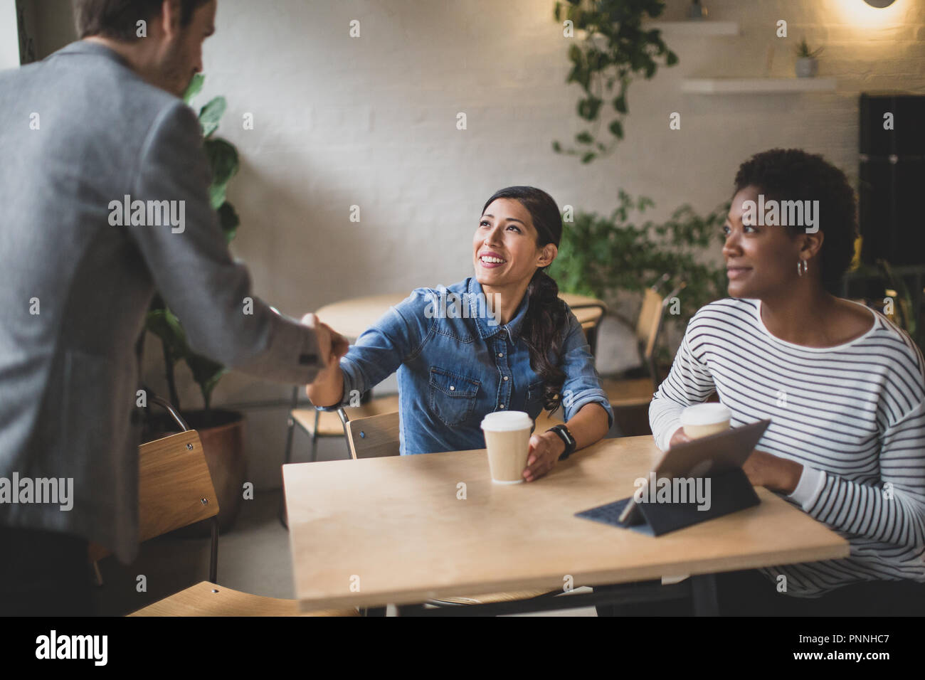 African interview meeting at cafe hi-res stock photography and images ...