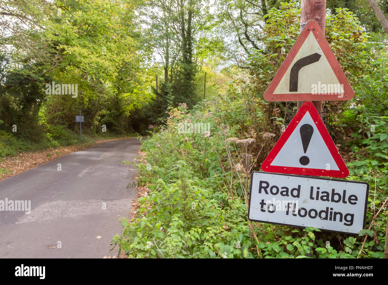 Flood warning sign on country road in England, UK Stock Photo - Alamy