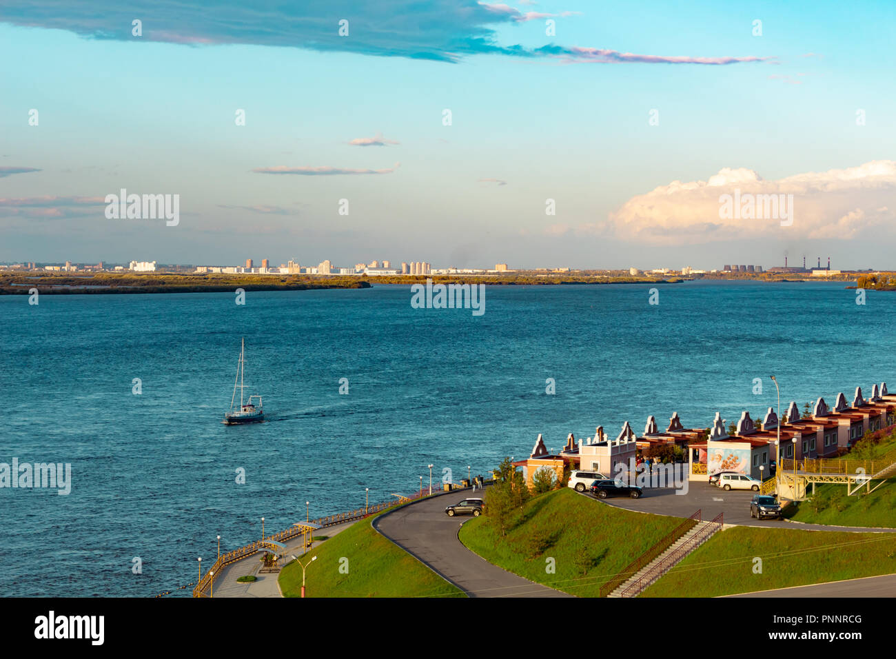 The yacht returns to the pier Stock Photo - Alamy