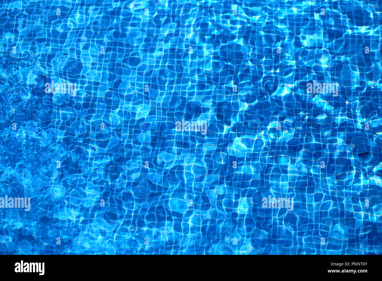 Photo background blue transparent water pool illuminated by the sun ...