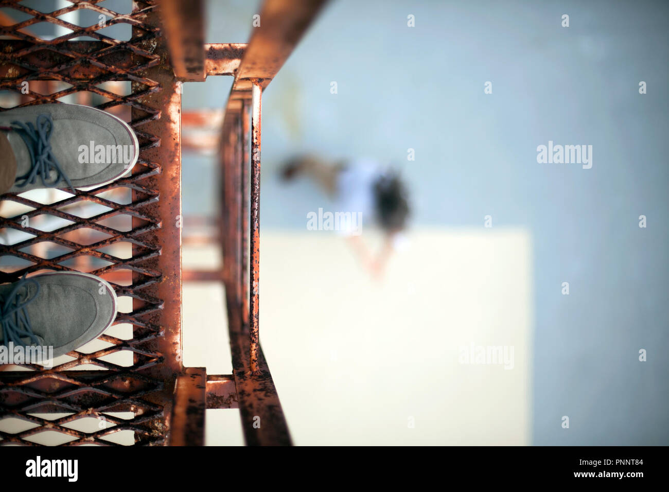 feet at the edge of fire escape Stock Photo - Alamy