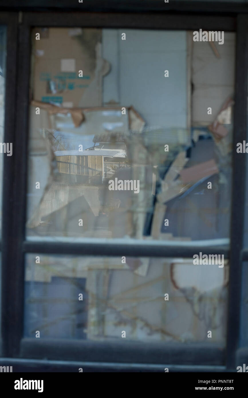 boarded up window with broken glass Stock Photo - Alamy