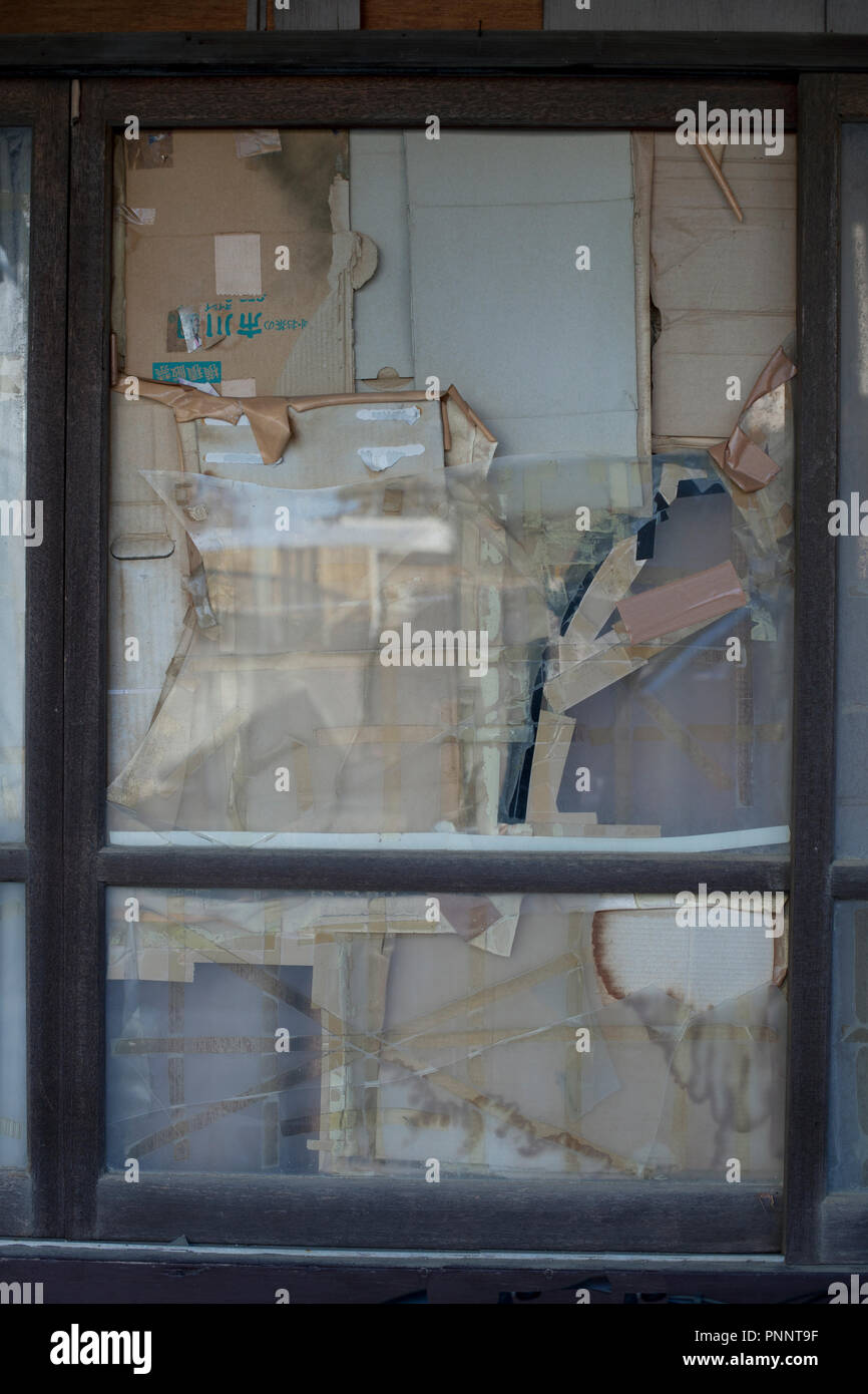 boarded up window with broken glass Stock Photo - Alamy