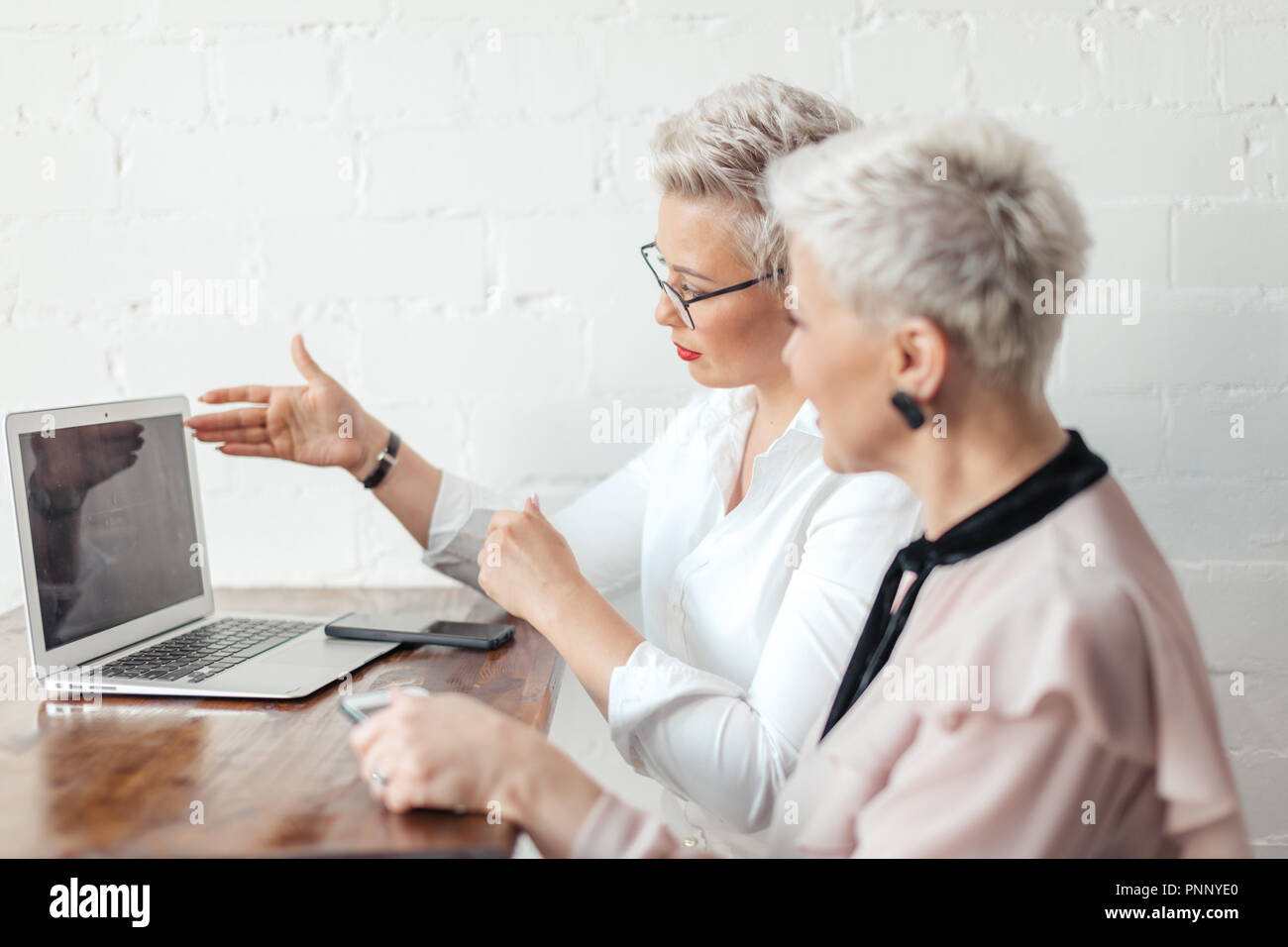 worker show presentation for her female boss or client Stock Photo - Alamy