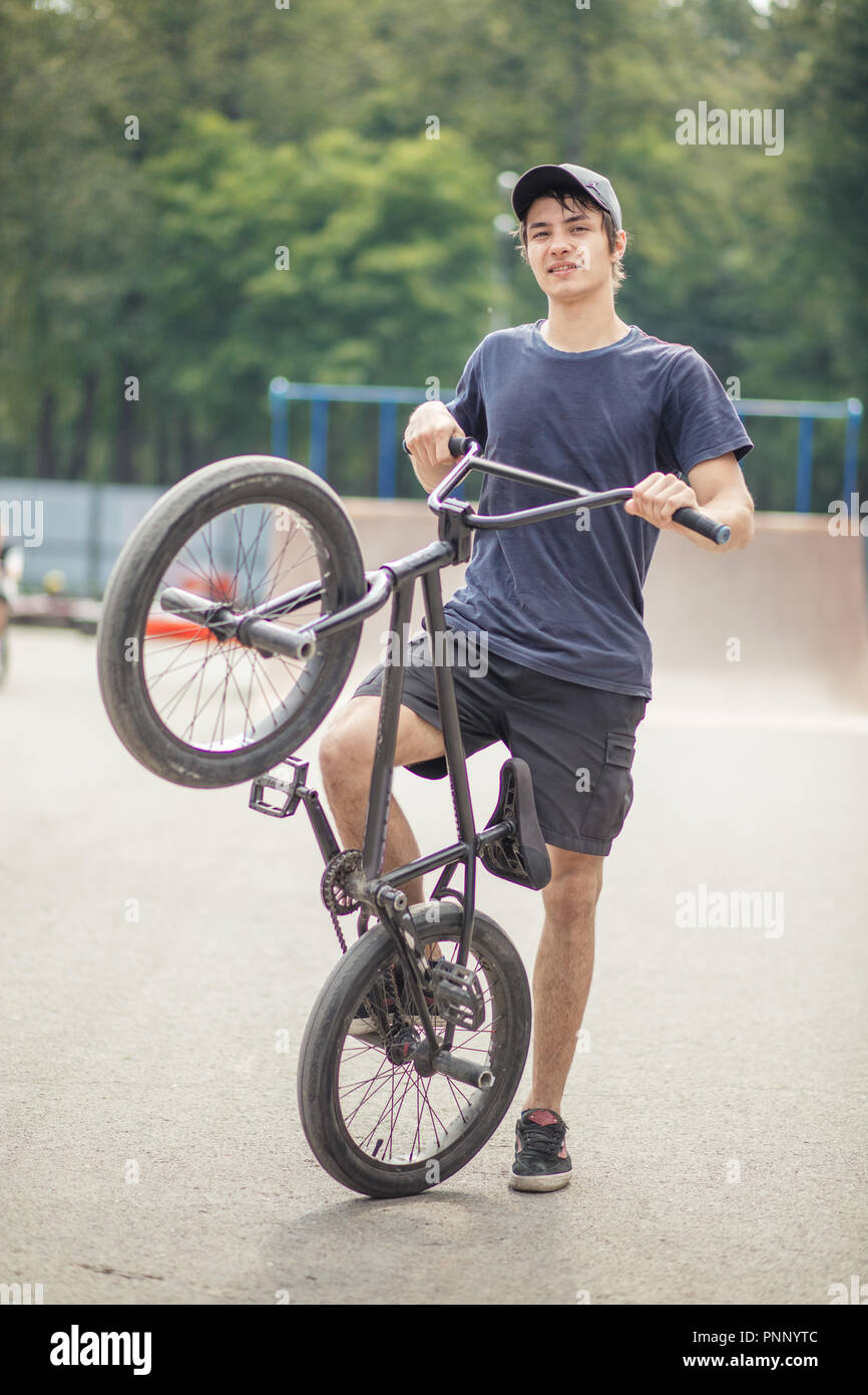 portrait of lookin girl posing in skate park with bmx Stock Photo - Alamy